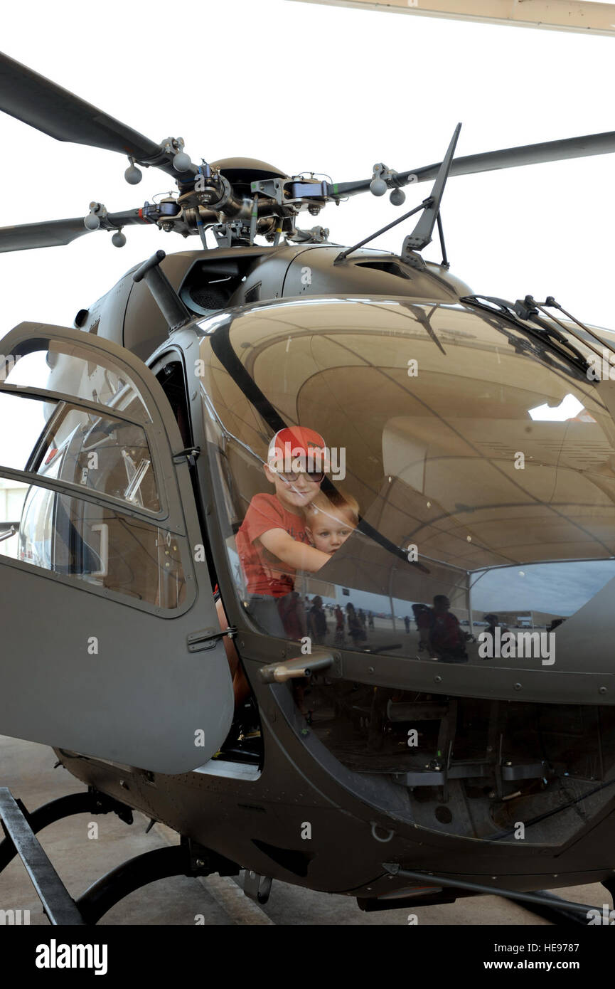 Two children sit inside the cockpit of a UH 72 Lakota during the ...