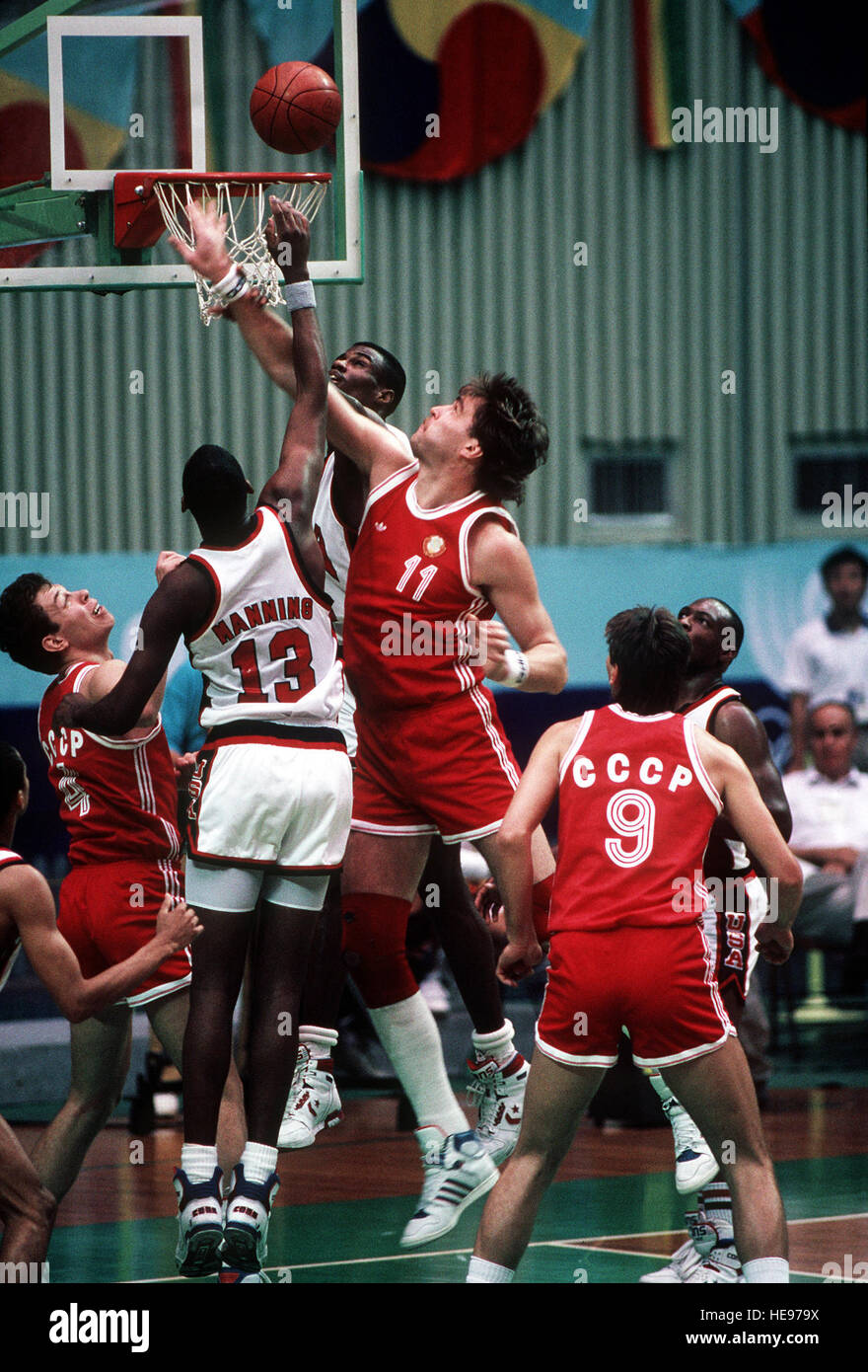 Danny Manning and the Navy's David Robinson battle a Soviet player for ...