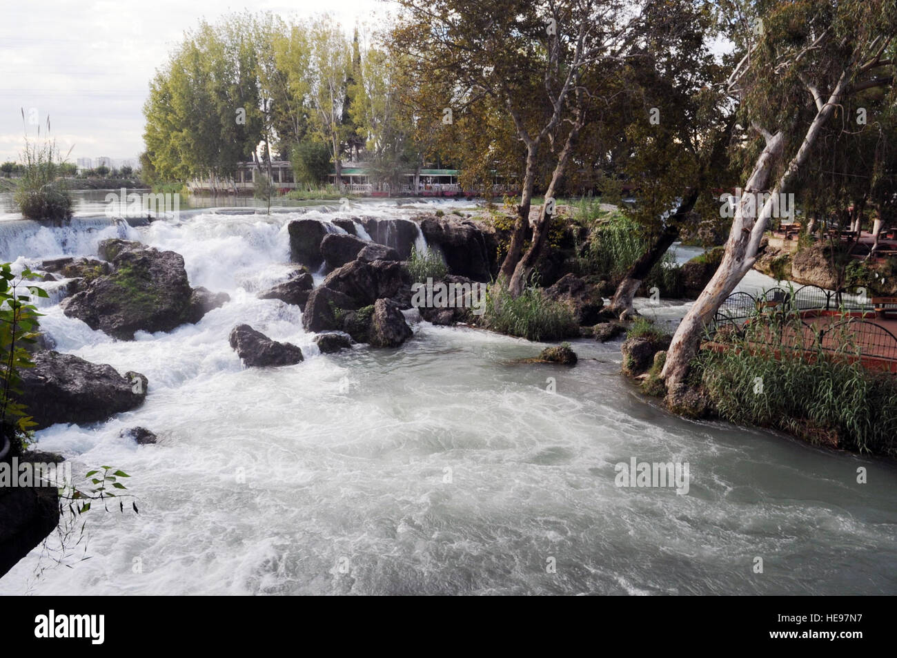 Water pours down the Berdan River waterfall, a popular picnic area for ...
