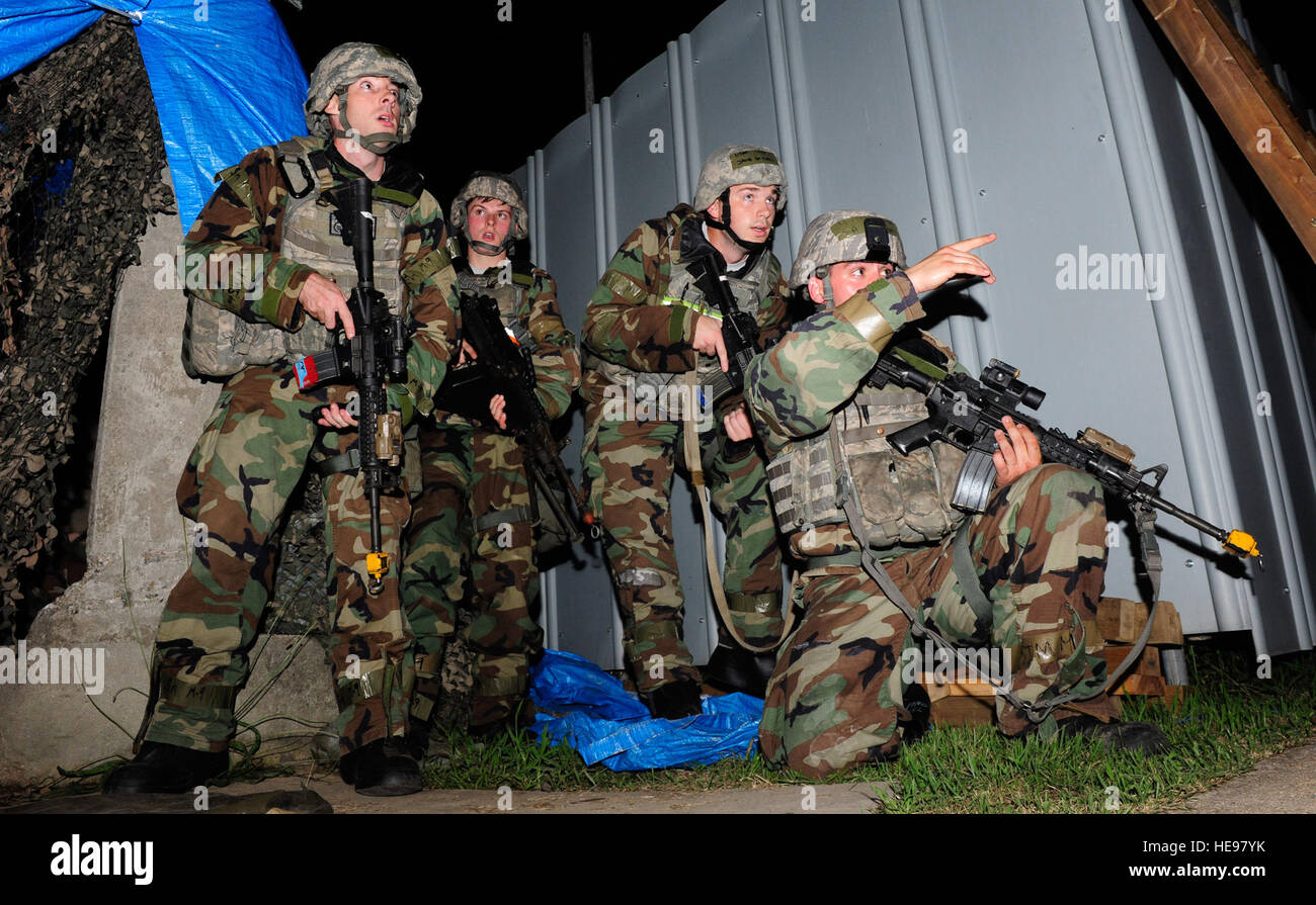 Airmen from the 8th Security Forces Squadron discuss procedures before ...