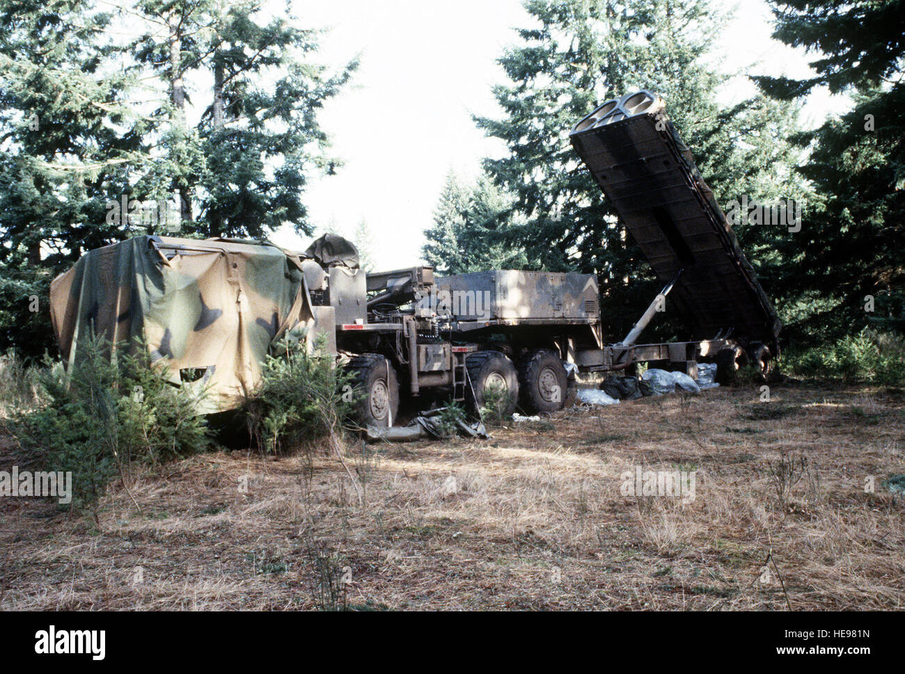 A parked transporter-erector-launcher (TEL) lifts the launcher into ...