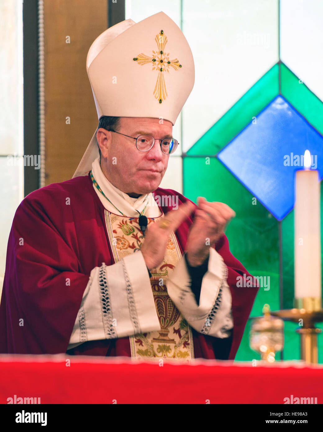 Bishop Neal Buckon applauds the Confirmandi students during the ...