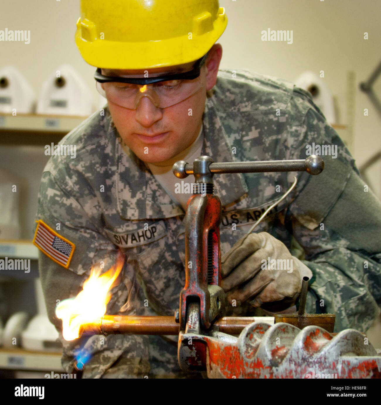 Army Pfc. Ryan Sivahop, Delta Company, 169th Engineer Battalion, uses a ...