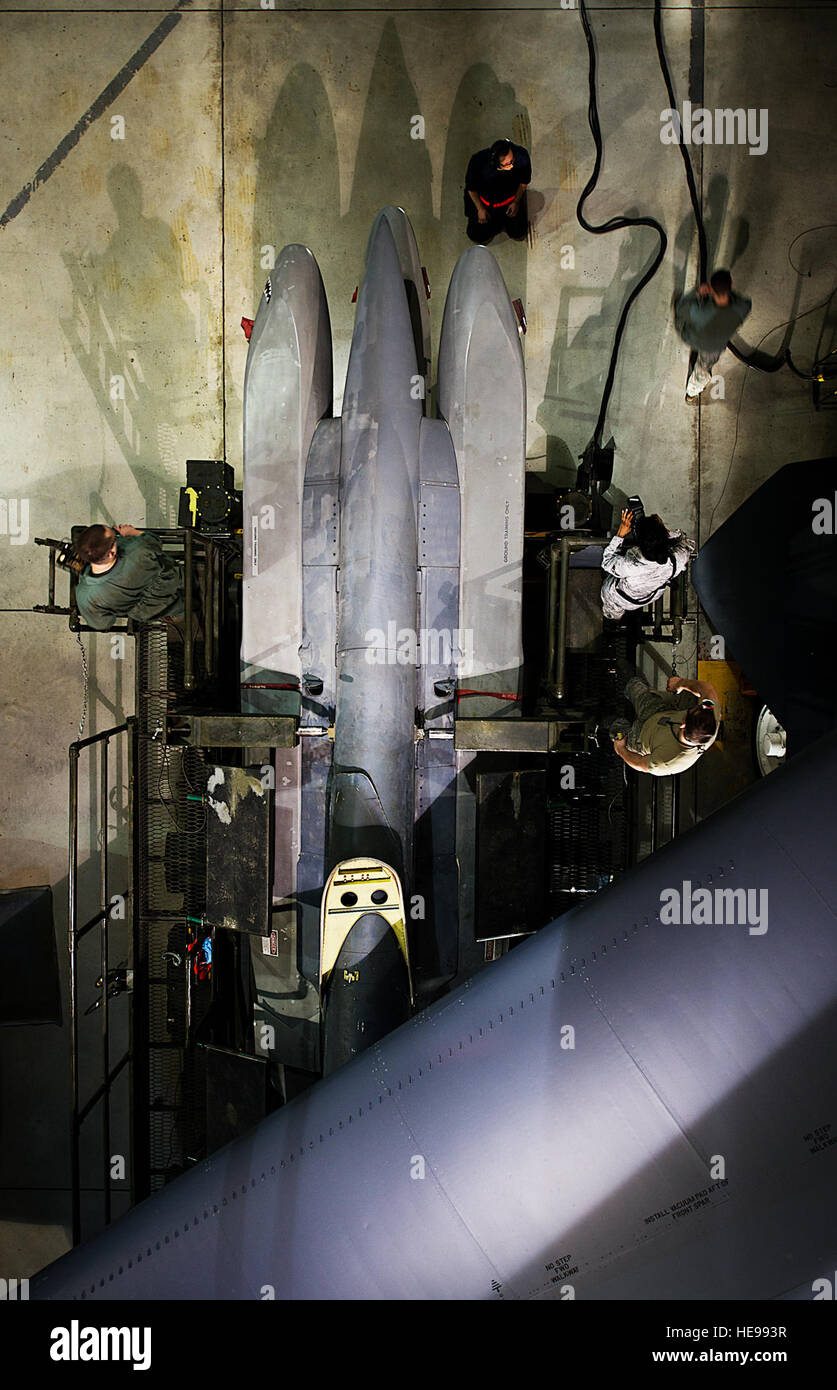5th Aircraft Maintenance Squadron load crews load a AGM-86B air-cruise ...