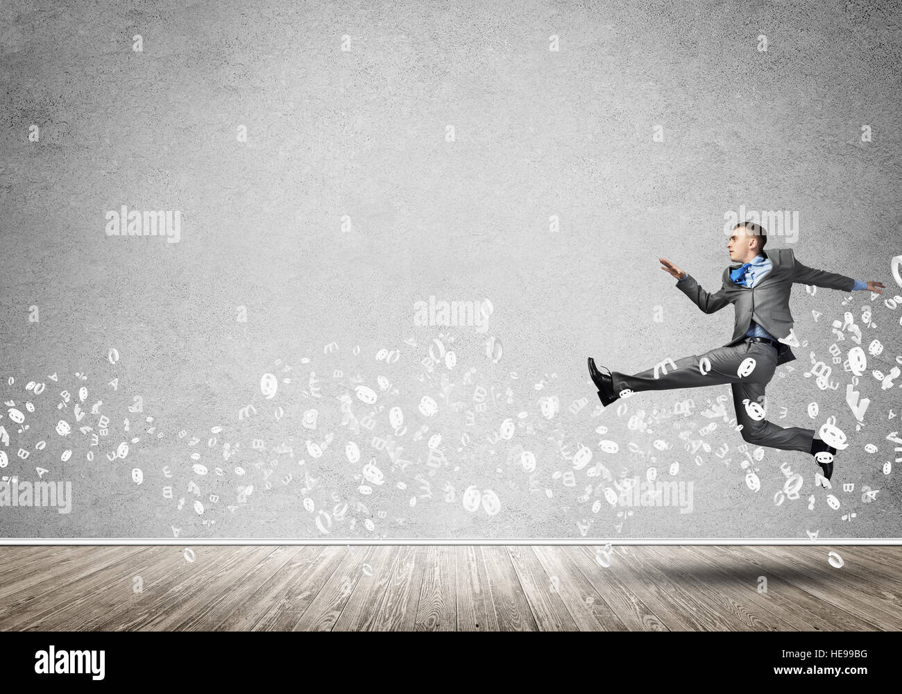 Young businessman in room running in a hurry Stock Photo - Alamy