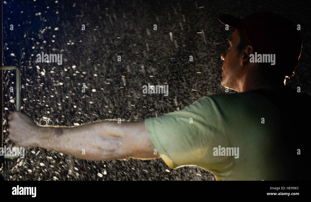 A RED HORSE Squadron member operates a drilling rig at a well site in ...