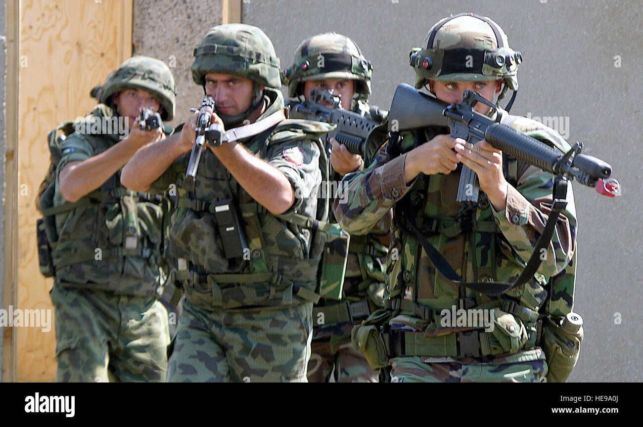 Bulgarian Army Soldiers train together on the proper way to enter and ...