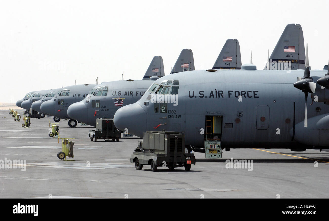 OPERATION IRAQI FREEDOM -- C-130 Hercules sit on the ramp at a forward ...