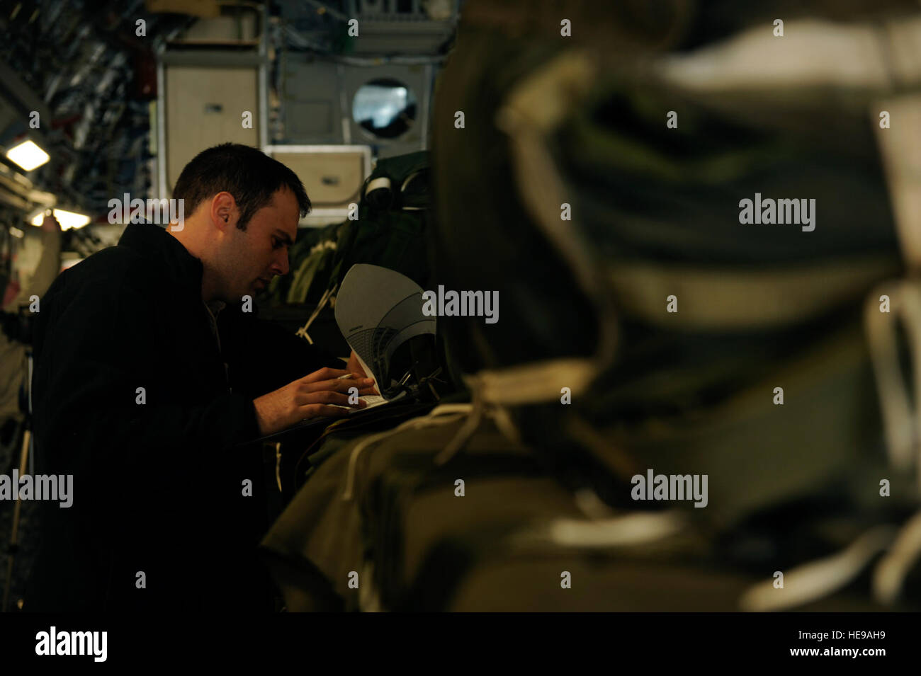 U.S. Air Force Staff Sgt. Steve Gore, a C-17 Globemaster III loadmaster ...