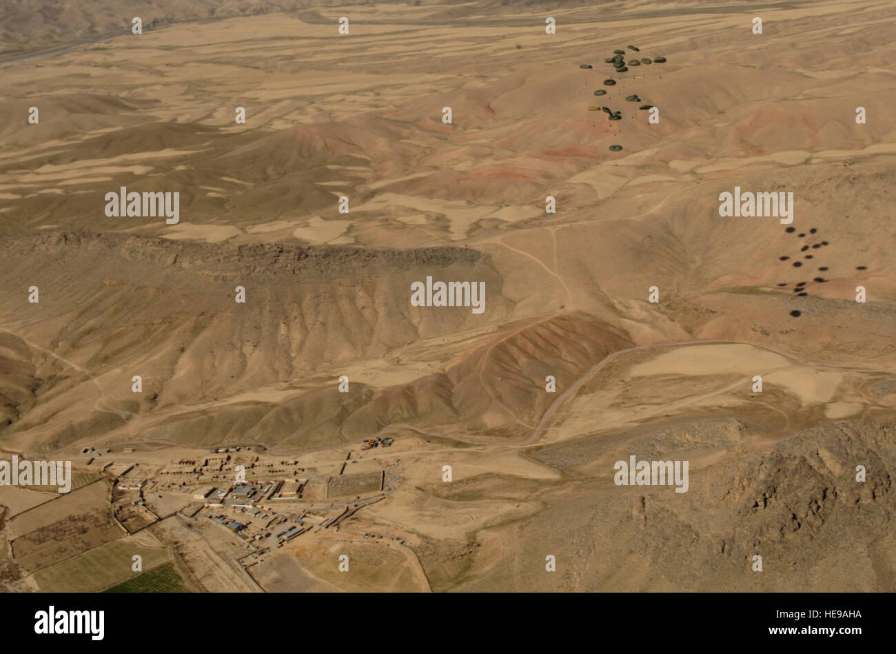 Container Delivery System (CDS) bundles fall to the drop zone after ...