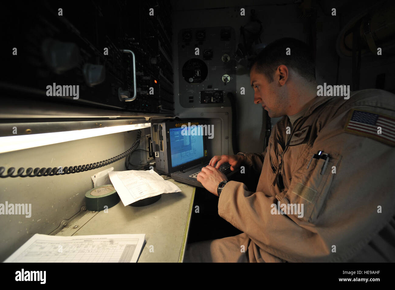 U.S. Air Force loadmaster Staff Sgt. Russ Ludeman inputs the weights of ...