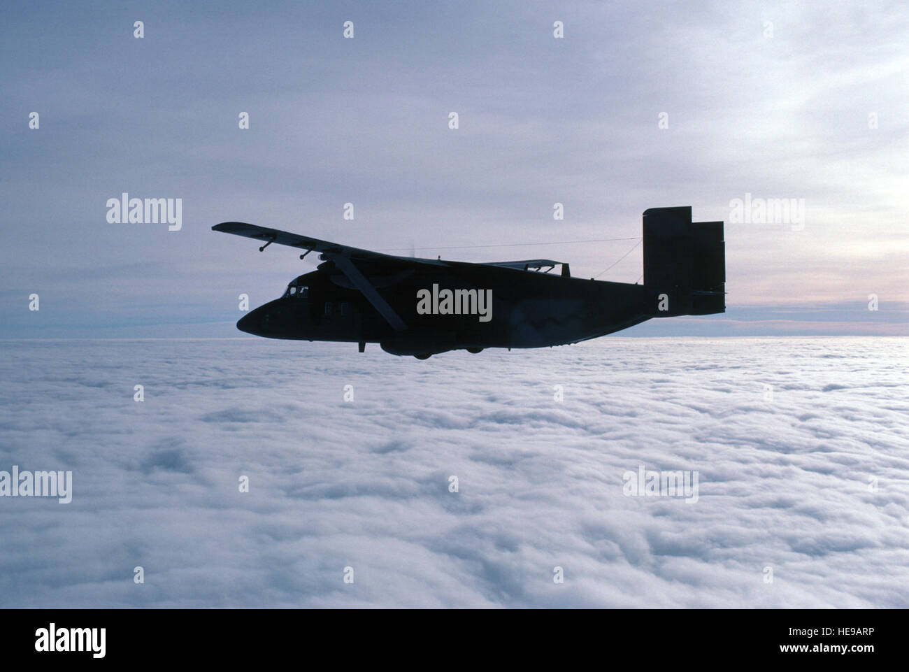 An air-to-air left side view of a C-23A Sherpa aircraft of the 10th ...