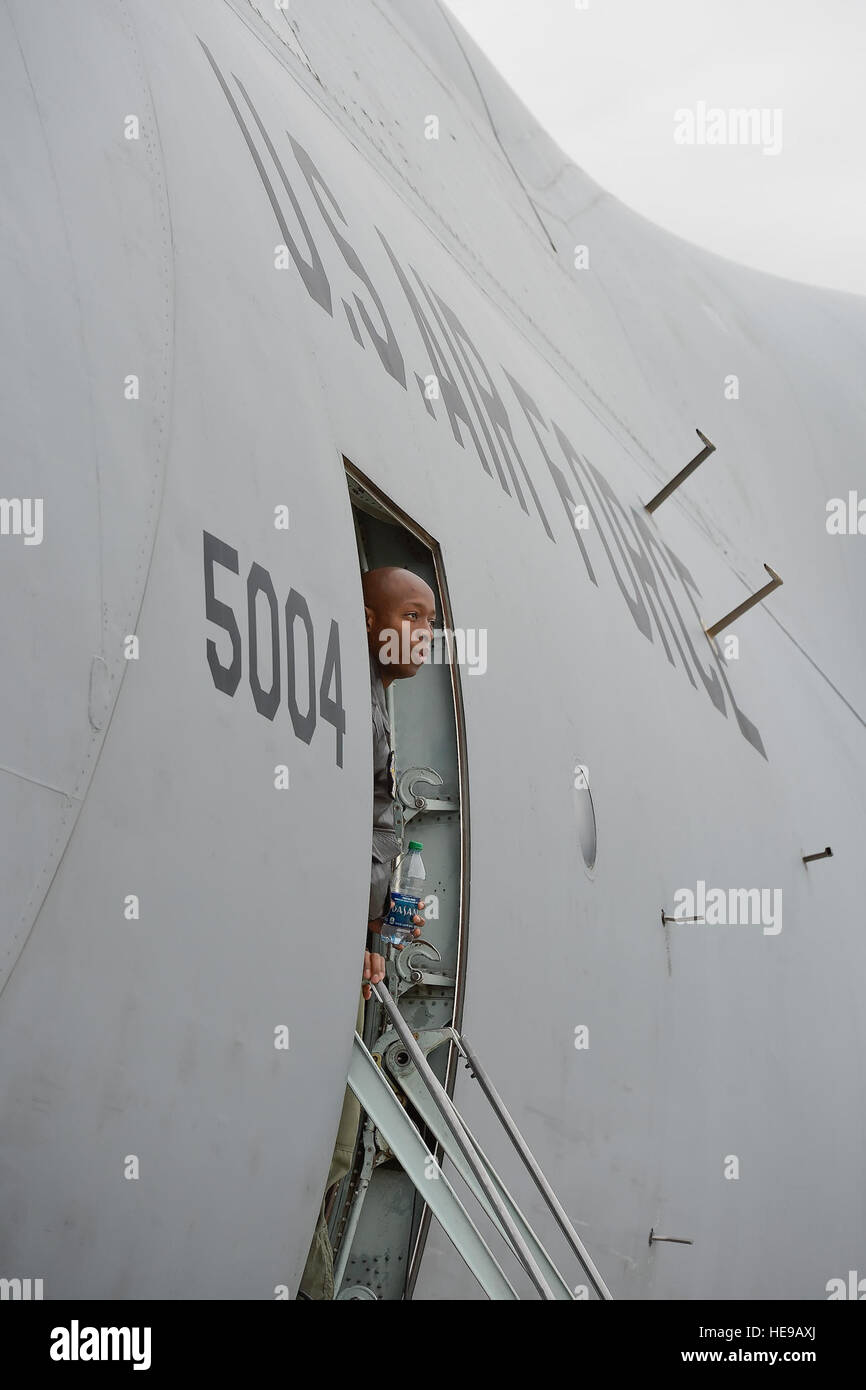 Staff Sgt. Alexis Miller, A C-5M Super Galaxy flight engineer, looks ...