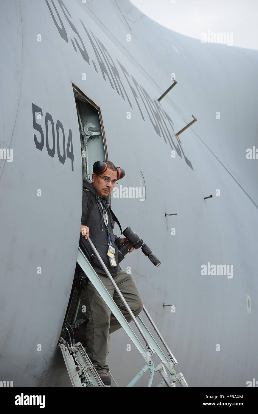 Roland Balik, 436th Airlift Wing photographer, exits C-5M Super Galaxy ...