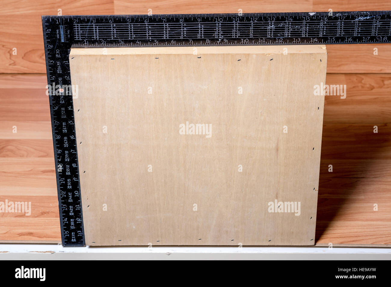 Construction square on a wood box Stock Photo - Alamy