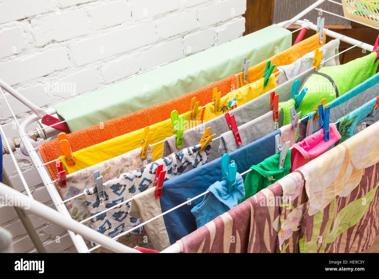 Close up clothes dryer and plastic clips. House clothes drying ...
