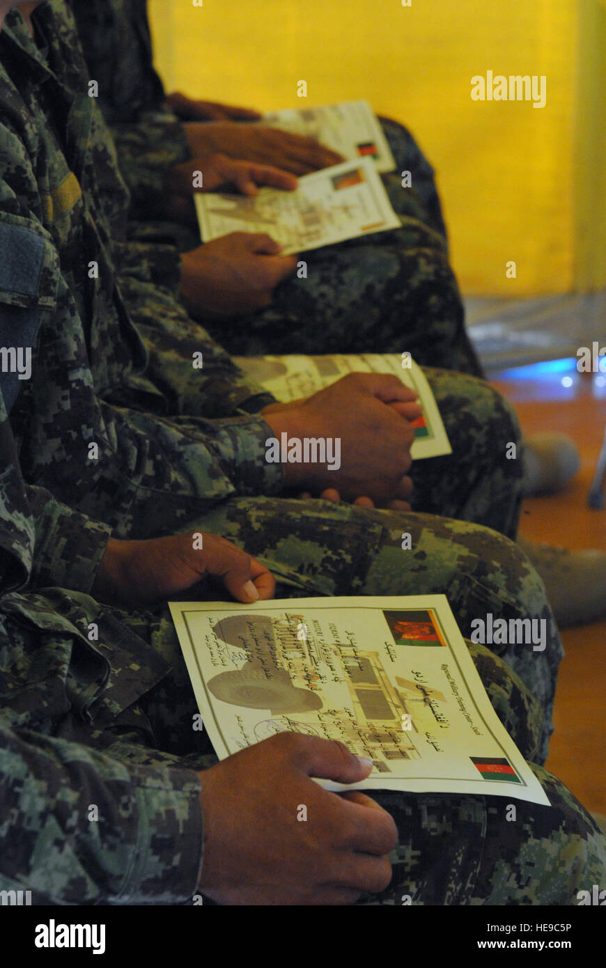 Certificates lay in the laps of Afghan National Army soldiers during ...