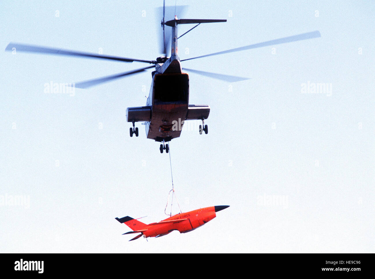 A ground-to-air rear view of a CH-3 Sea King helicopter recovering a ...