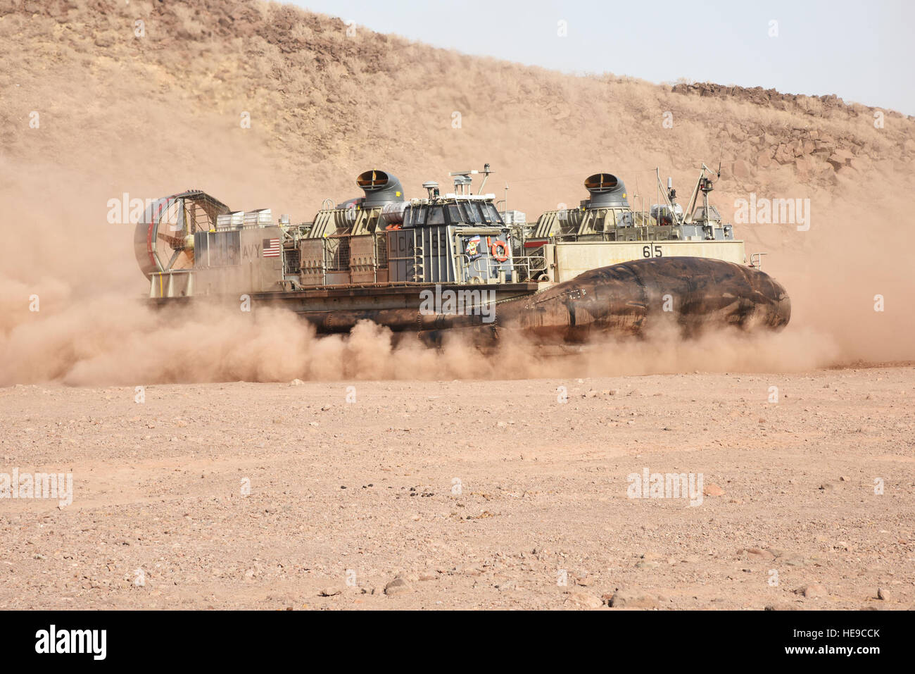 A U.S. Navy Landing Craft Air Cushion (LCAC) departs a beach in Arta ...