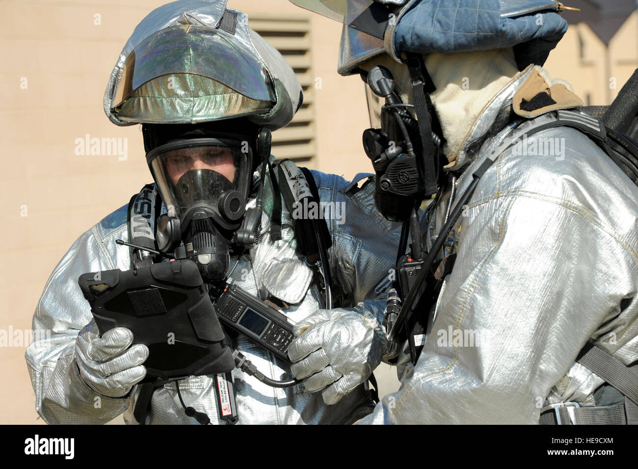 U.S. Airmen with the 375th Civil Engineer Squadron look at a map during ...