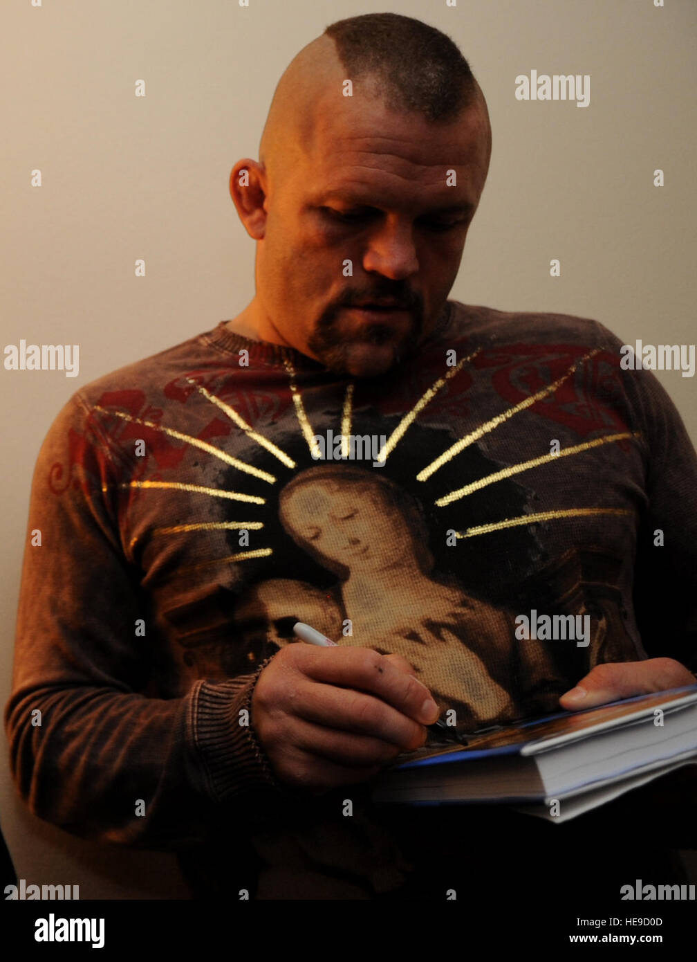 U.S. Air Force Airman 1st Class Eric Fowler gets a book signed by UFC ...