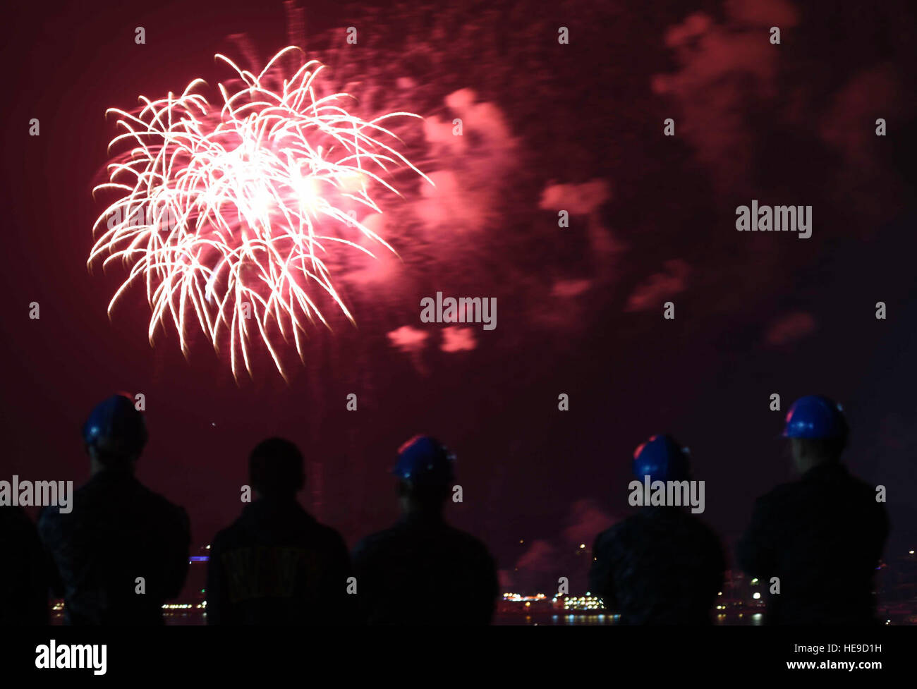 Sailors aboard USS Nimitz (CVN 68) watch a fireworks display over Puget ...