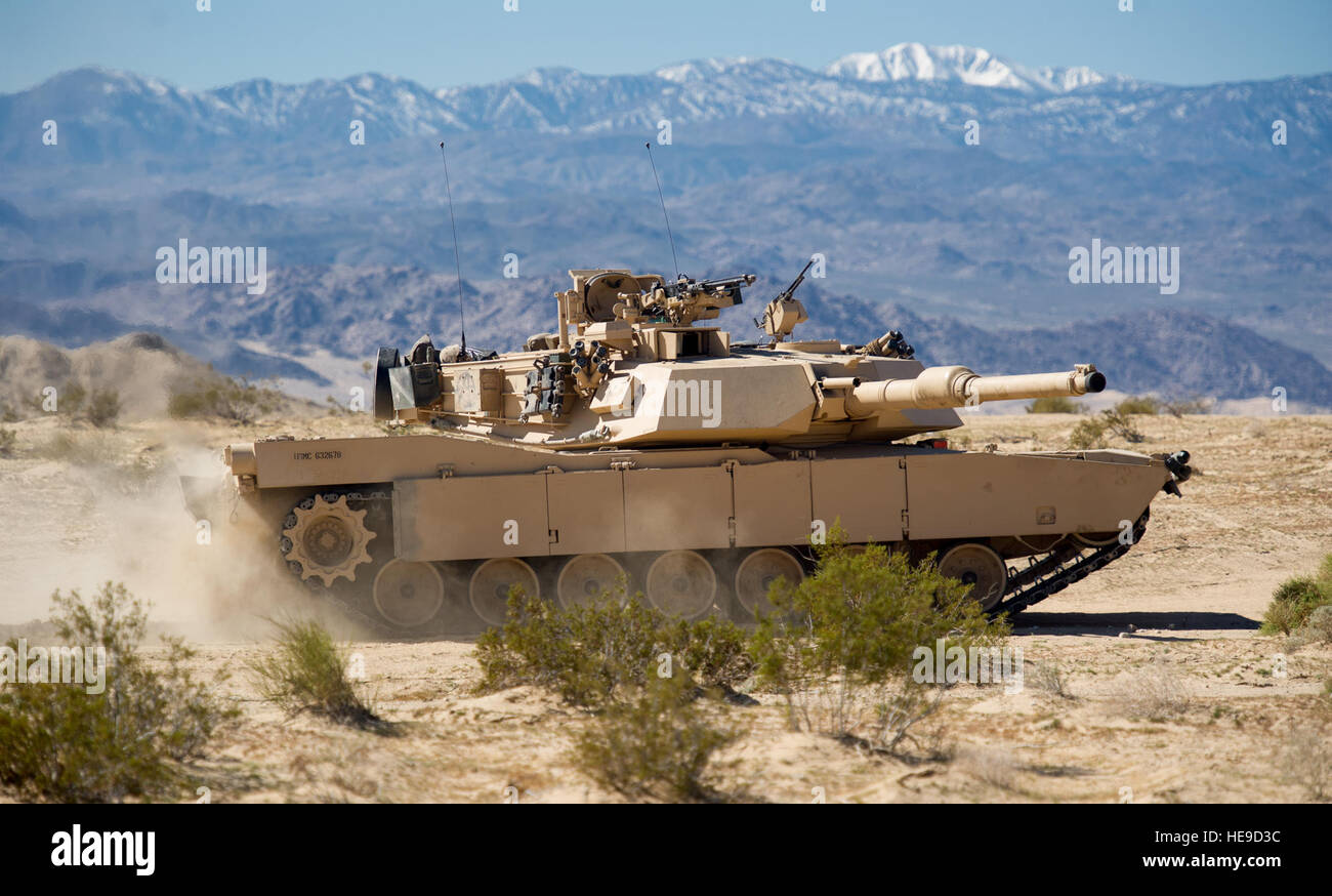 A U.S. Marine M1A1 Abrams tank moves toward its next objective during ...