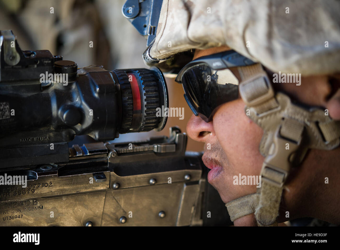 A U.S. Marine aims down his weapon’s scope during an urban clear ...