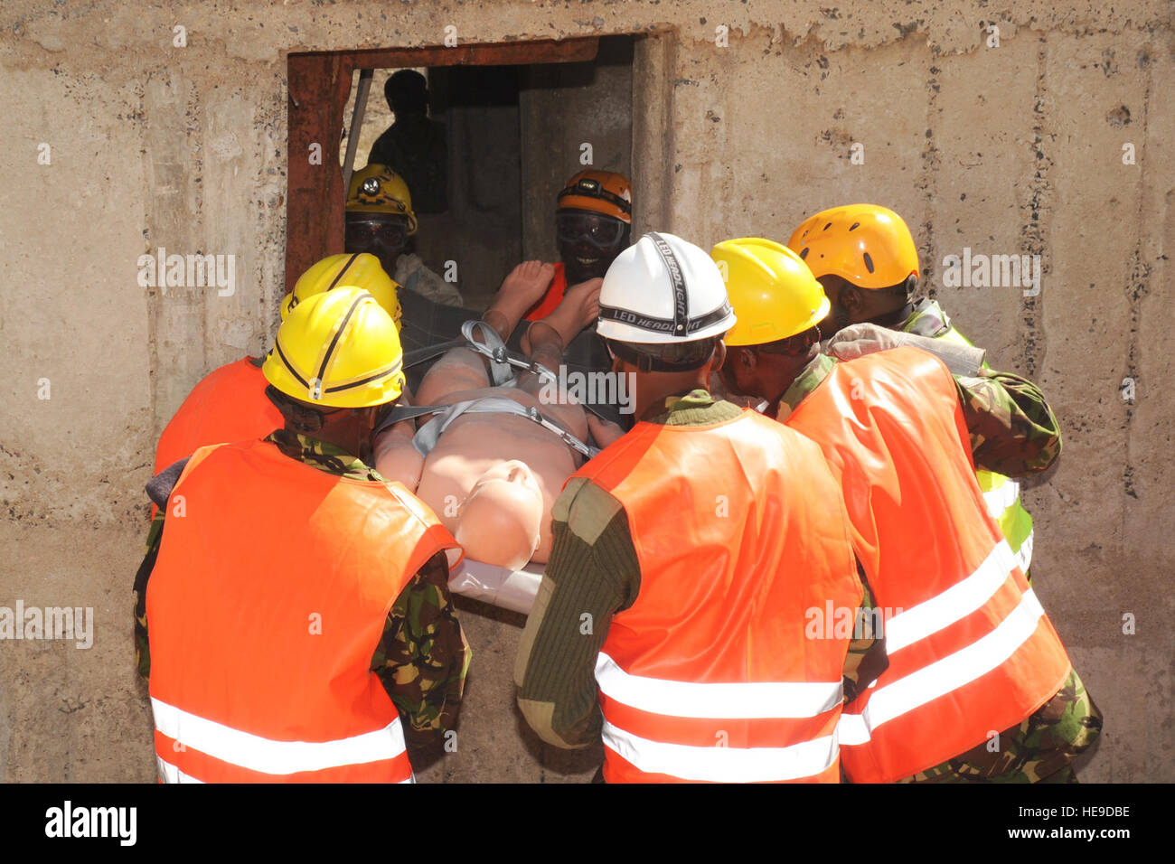 Members of Kenya's Disaster Response Unit work together to safely ...