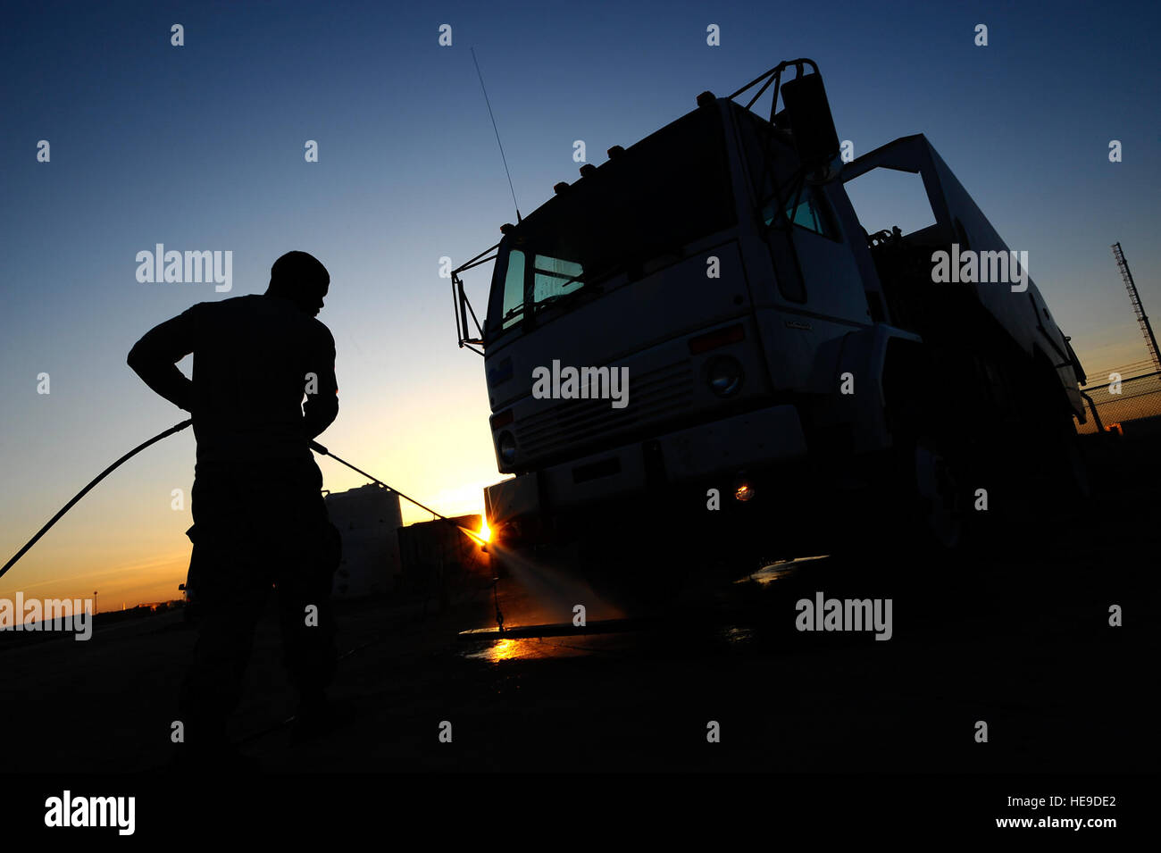 Staff Sgt. Monwell Chassion pressure washes a sweeper at Joint Base ...