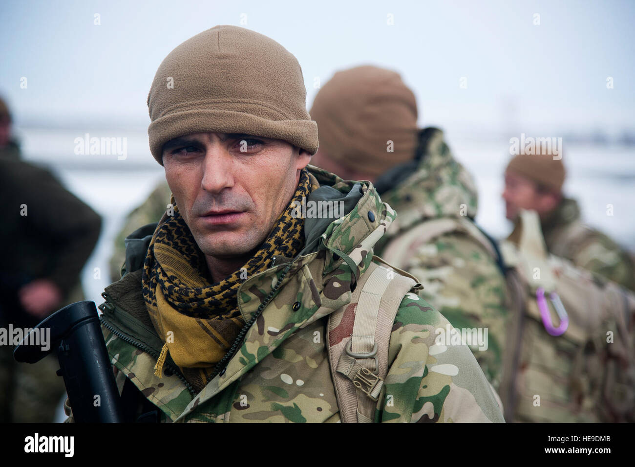 An Albanian military member waits to board a plane at Transit Center at ...