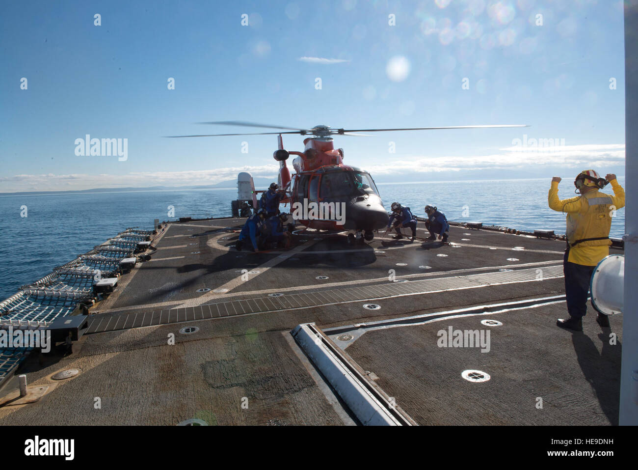 Crewmembers aboard the Coast Guard Cutter Midgett, a 378-foot high ...