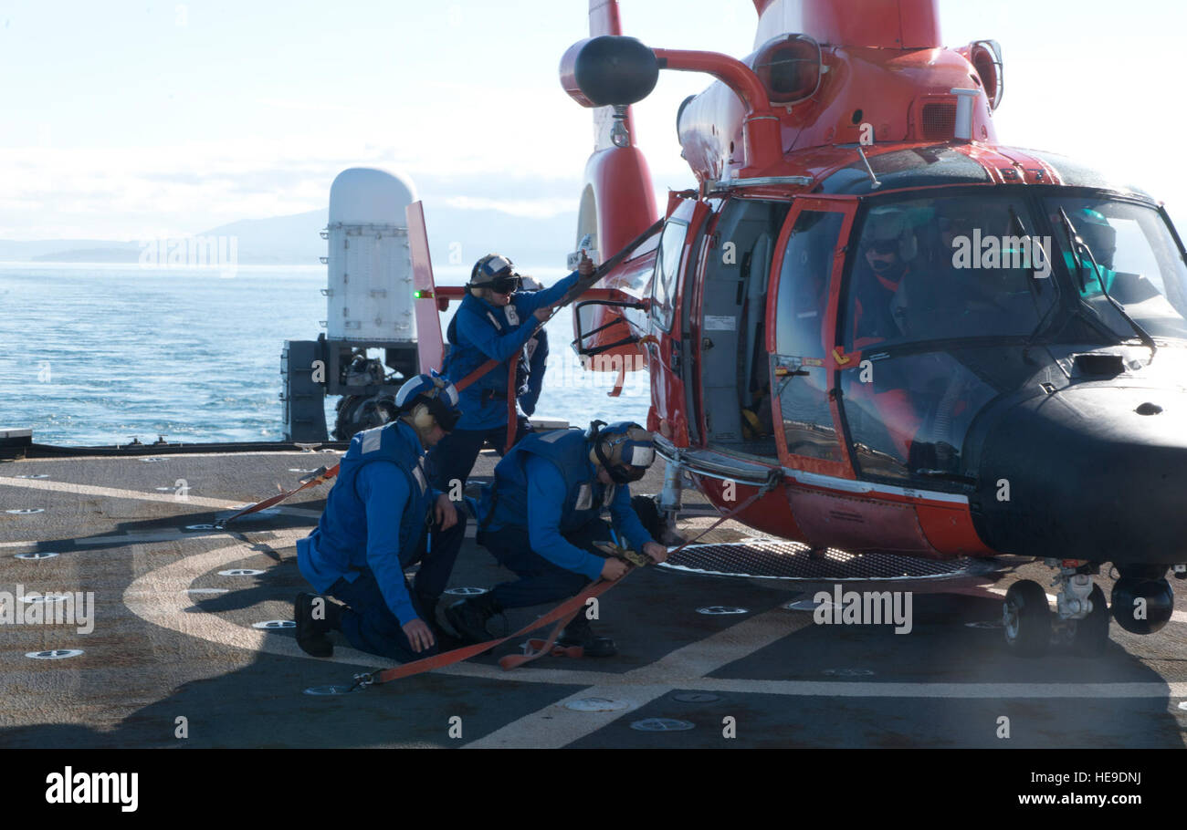 Crewmembers aboard the Coast Guard Cutter Midgett, a 378-foot high ...