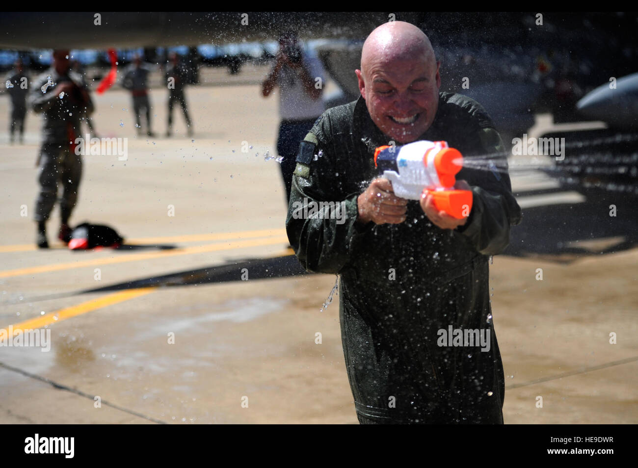 U.S. Air Force Col. Scott Long, commander 388th Fighter Wing, sprays ...