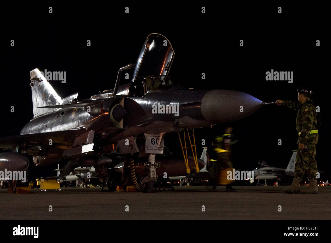 Colombia air force air crew members prepare the Kfir for a night ...
