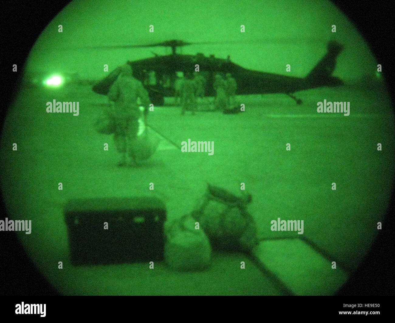 U.S. Army Soldiers from101st Airborne Division, load cargo into a UH-60 ...