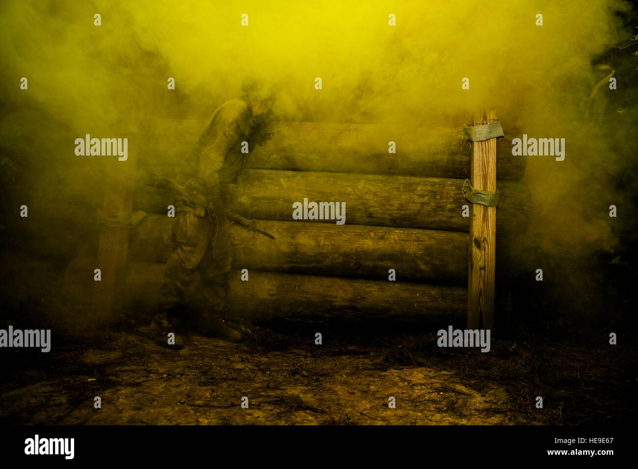 A Marine with 2nd Combat Engineer Battalion prepares to clear a log ...