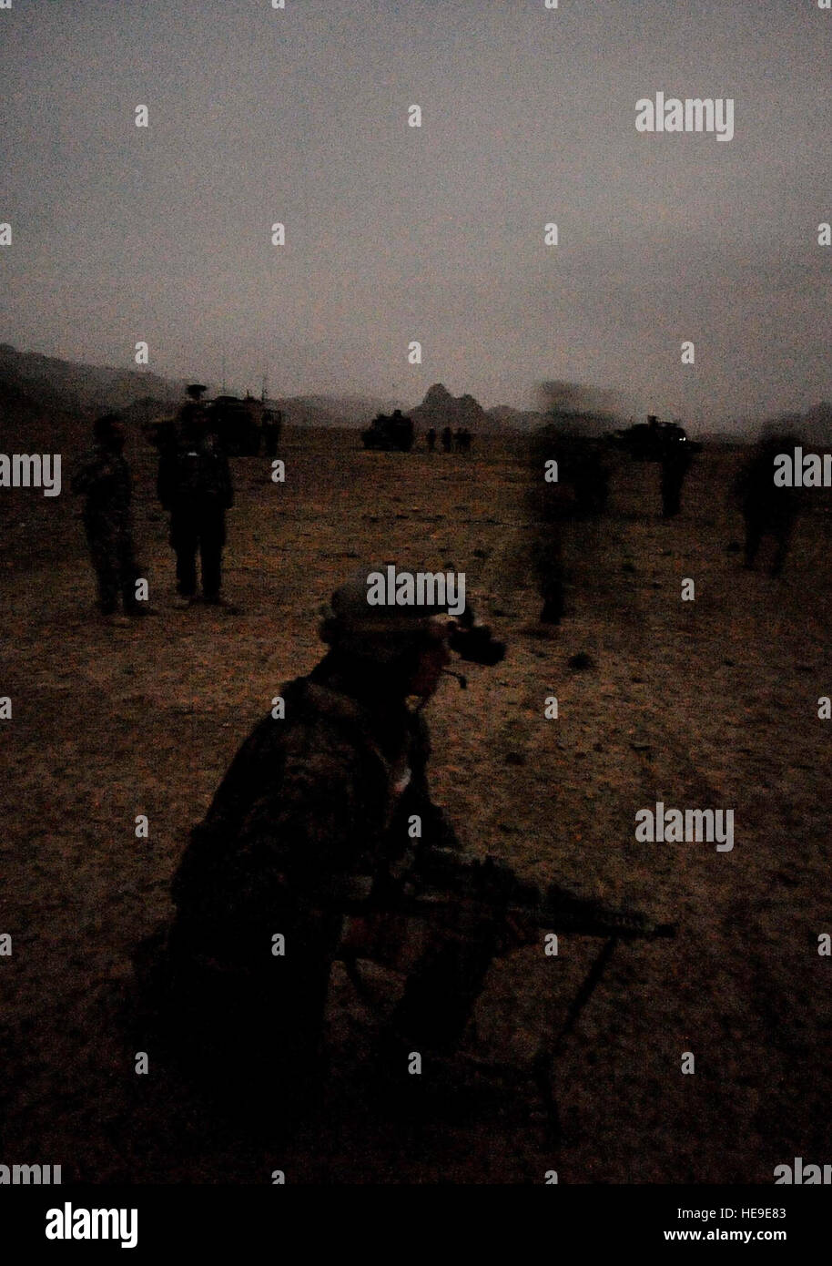 A MARSOC Marine secures a campsite during a multi-day mission in the ...