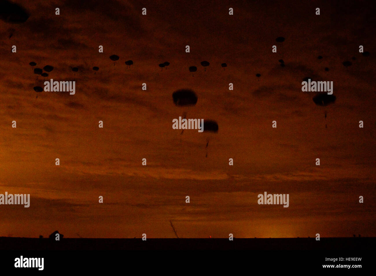 U.S. and U.K. military paratroopers conduct night static-line jumps at ...