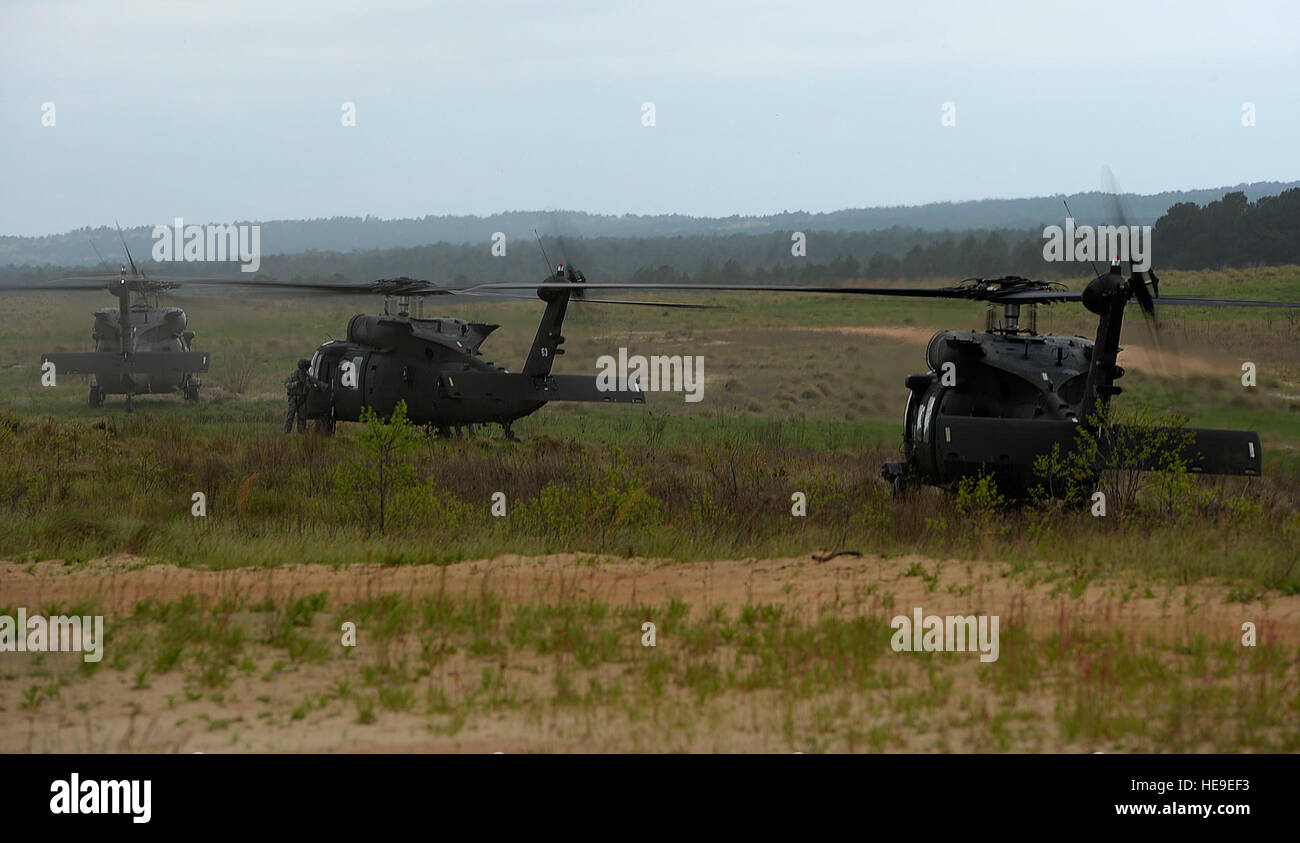 UH-60 Blackhawk helicopters land at Holland Drop Zone to pick up ...