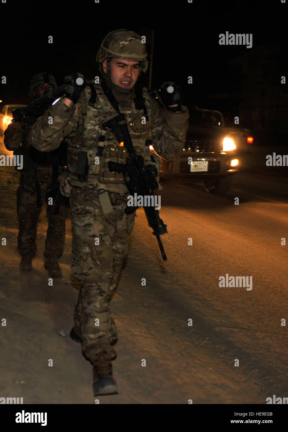 Senior Airman Curtis Turner and Senior Airman Jonathan Bussard carry a ...
