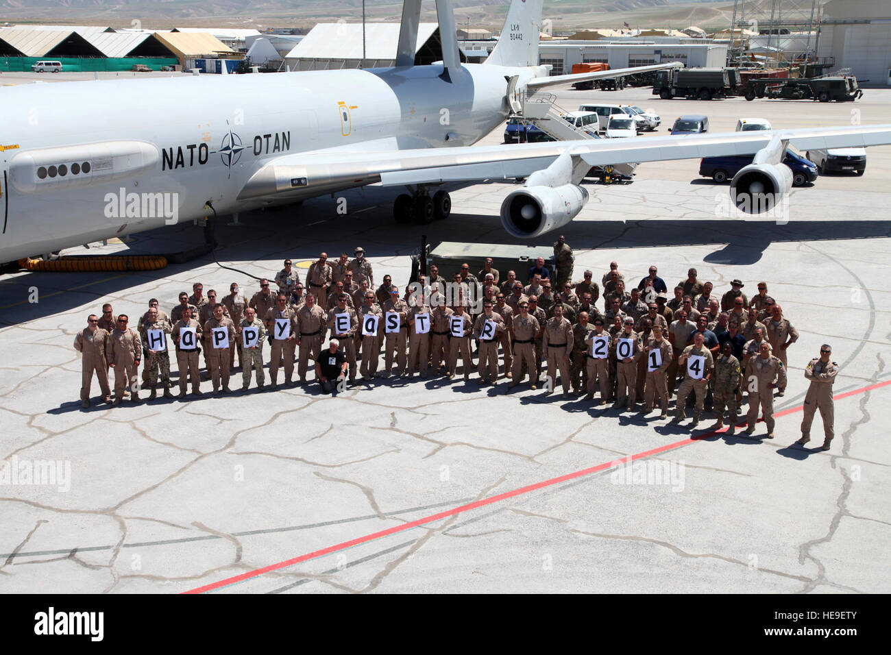 Deployed members of the E-3A Component pose for a group picture at Camp ...