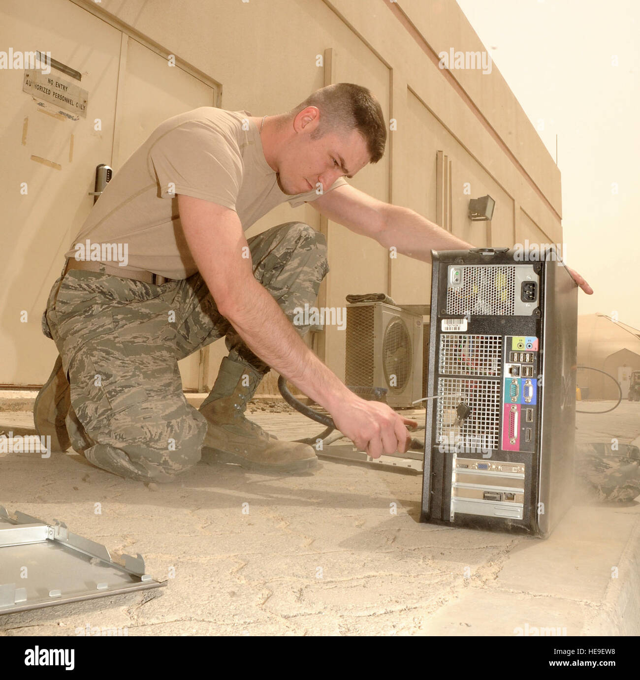 SOUTHWEST ASIA - Staff Sgt. Anthony Sullivan cleans computers with an ...
