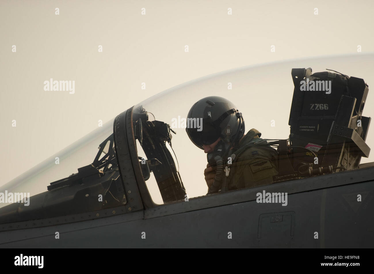 A U.S. Air Force pilot with the 44th Fighter Squadron prepares an F-15C ...