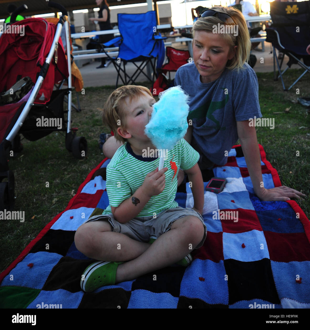 Henry Koch eats cotton candy with his mom, Staff Sgt. Caitlin E. Jones ...