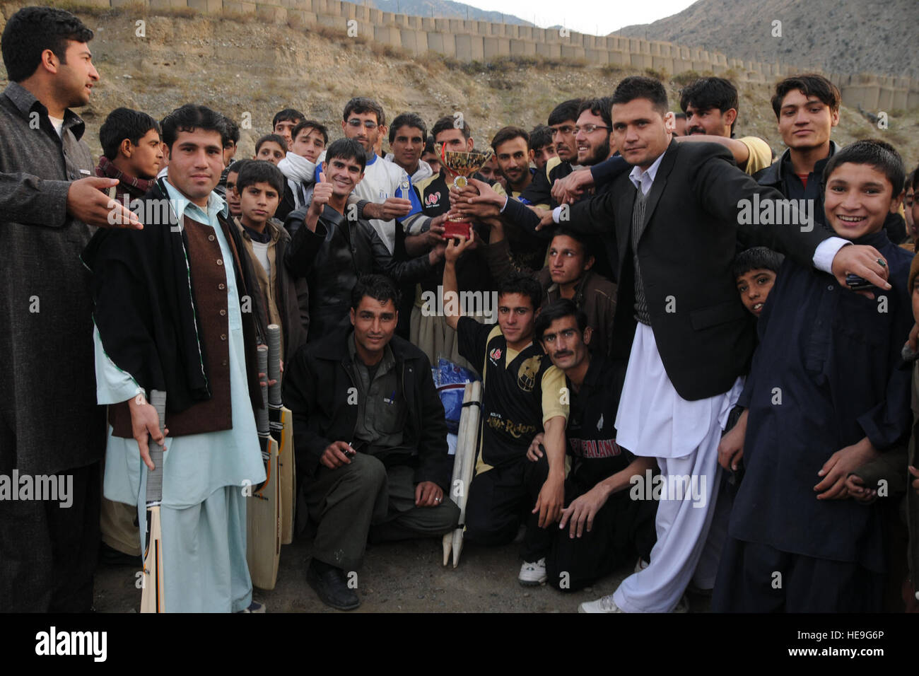 The Dam Kalay Tigers celebrate their victory after a rousing ...