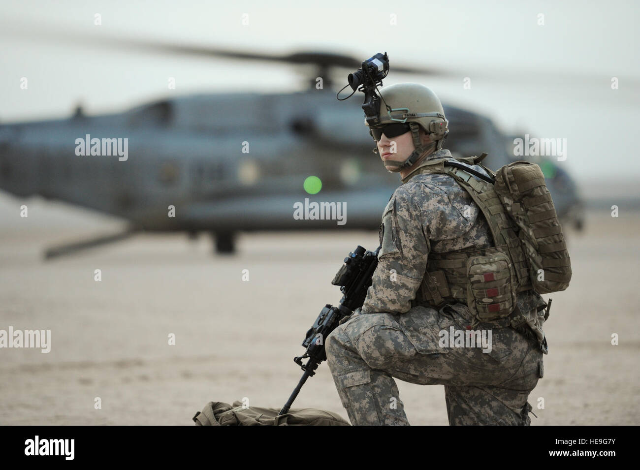 A U.S. Army soldier provides security prior to cross-loading simulated ...