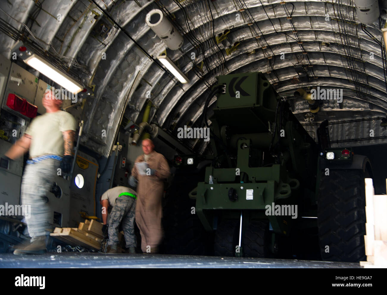 A Rough Terrain Container Handler sits inside of a C-17 Globemaster III ...
