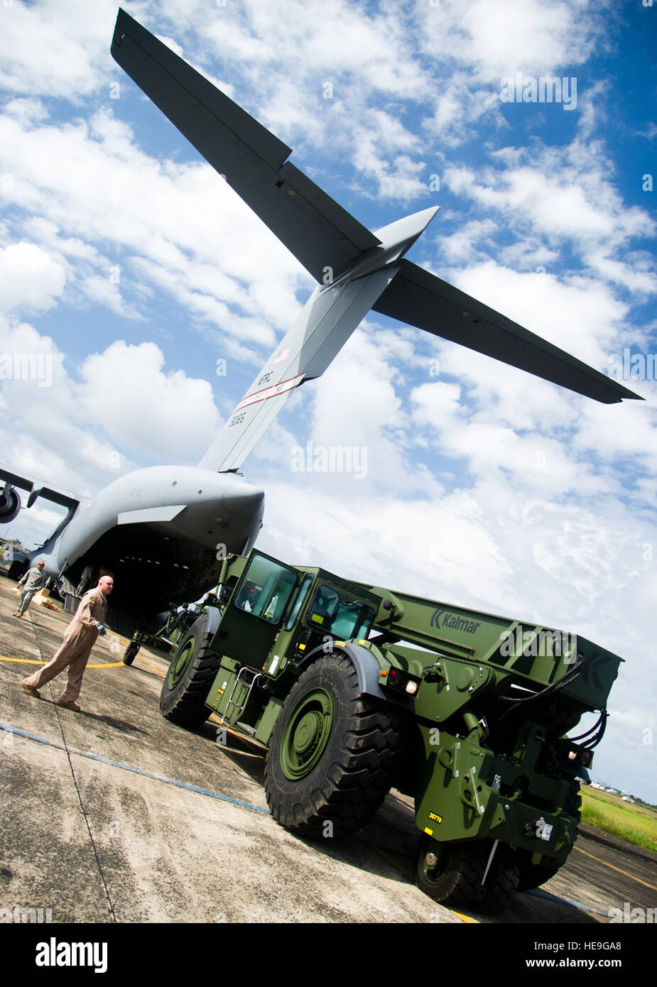 A Rough Terrain Container Handler sits inside of a C-17 Globemaster III ...