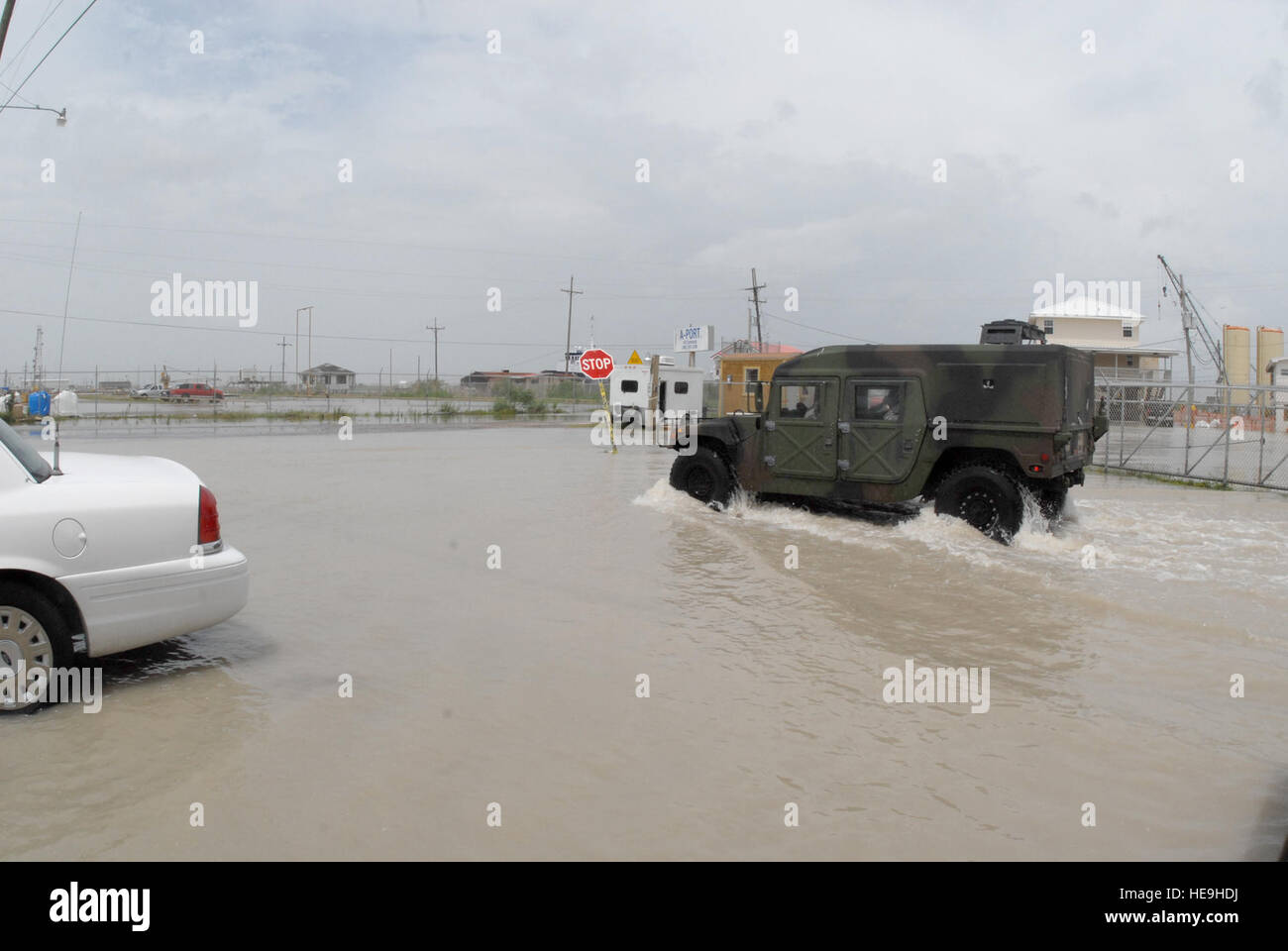 A Louisiana National Guard Humvee drives through deep water on the ...